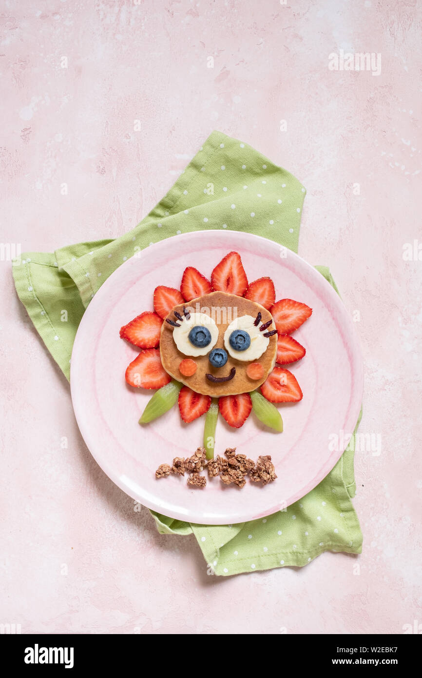 Funny Flower Pancake with berries for kids Stock Photo - Alamy