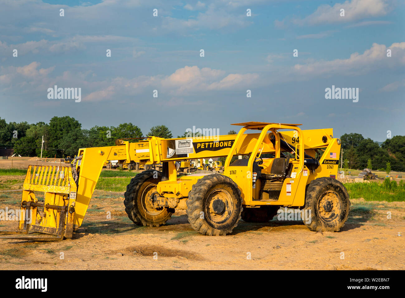 A backhoe at a construction site Stock Photo - Alamy