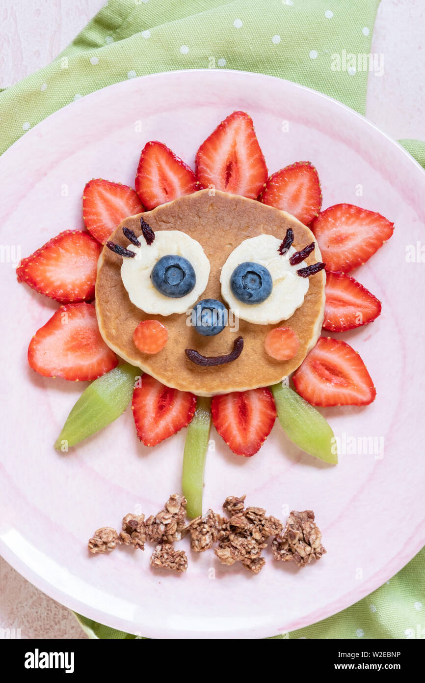 Funny Flower Pancake with berries for kids Stock Photo - Alamy