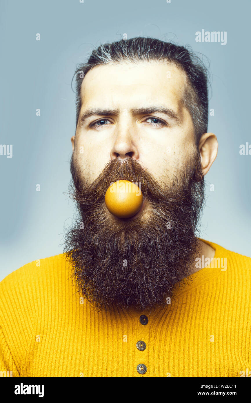 handsome bearded man with long lush beard and moustache on serious sad ...