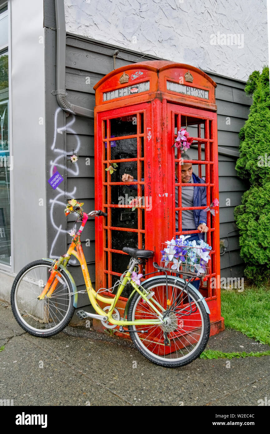 Bicycle with flowers and old British Telephone booth, Commercial Drive ...