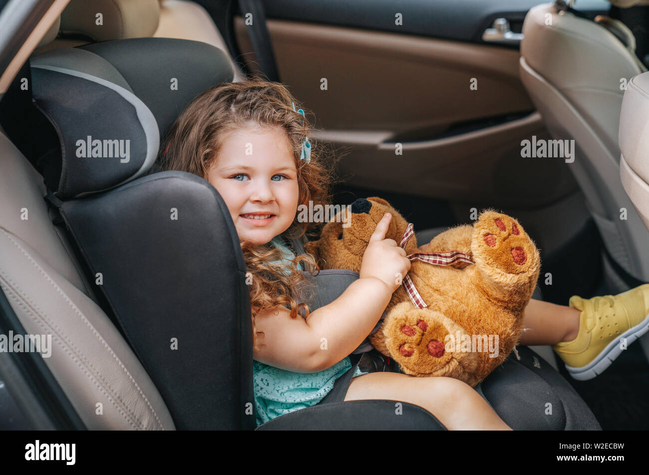 Cute little baby child sitting in car seat. Portrait of cute little ...