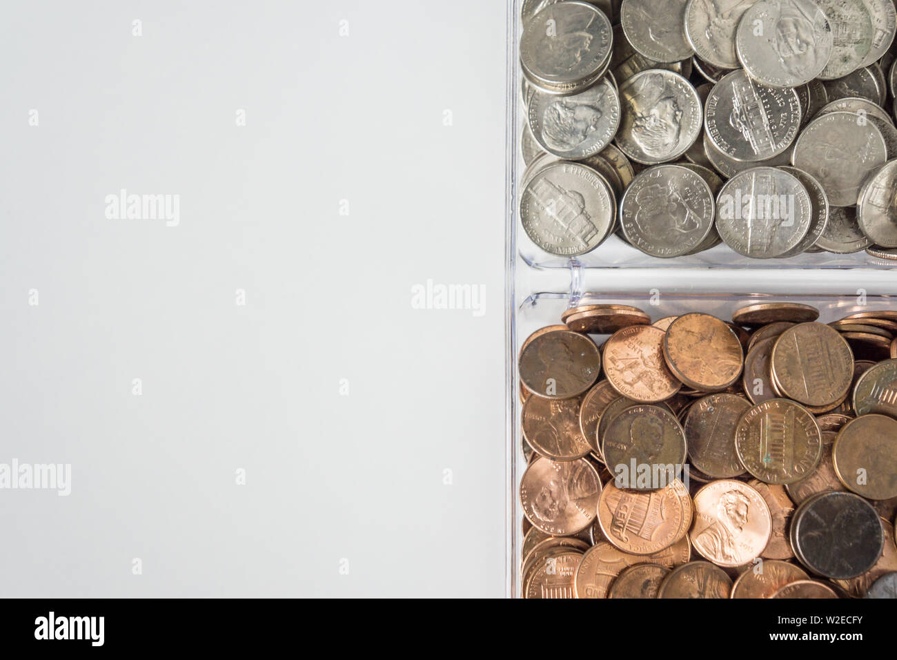 Isolated organized loose coin change on right side, white background ...