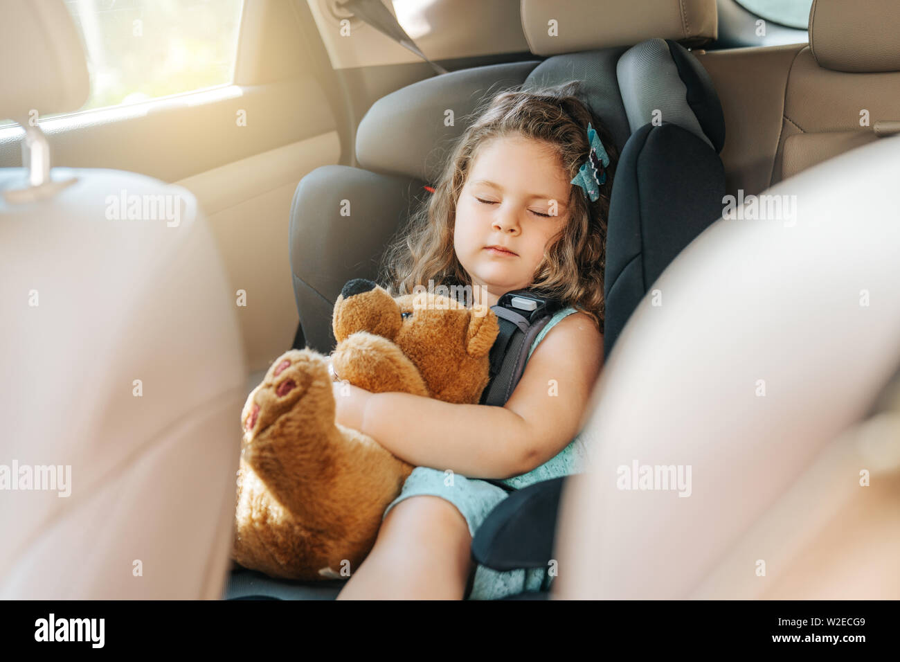 Cute little baby child sitting in car seat. Portrait of cute little ...