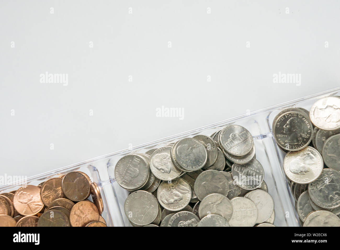 Isolated organized loose coin change on bottom side, white background ...
