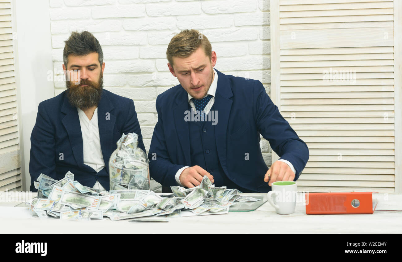 Business partners, businessmen at meeting in office. Bearded boss and ...