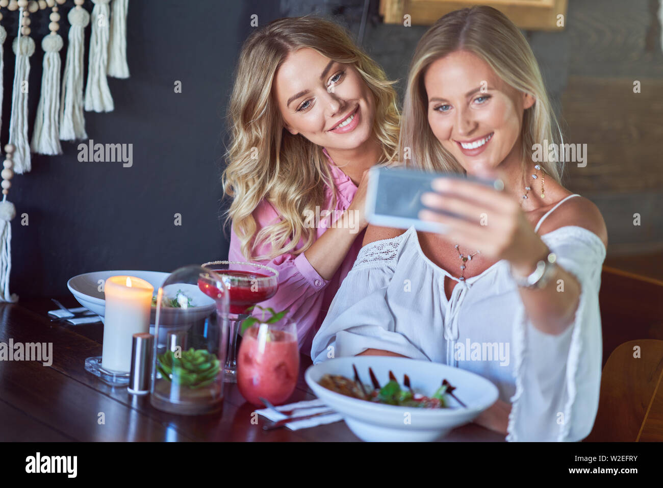 Texting at dinner table hi-res stock photography and images - Alamy