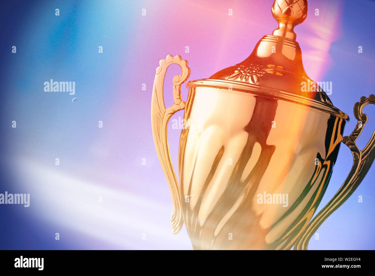 Close up of a silver trophy prize with an ornate lid and handles for ...