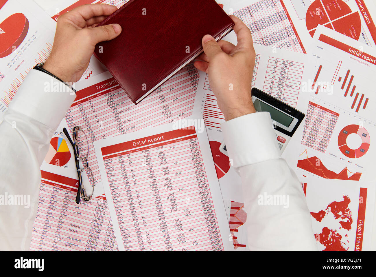 Business reports, data tables and charts - directly above view of ...