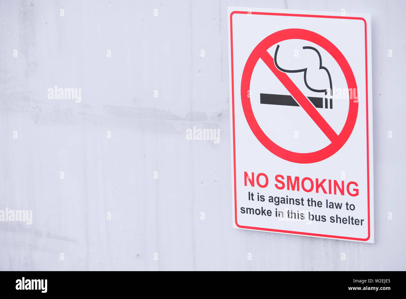 No smoking at bus shelter sign Stock Photo - Alamy