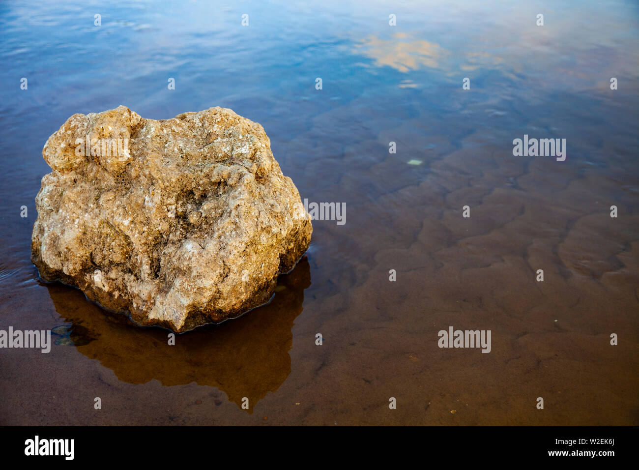 Beautiful landscape with a calm river. Stone in the river Stock Photo ...