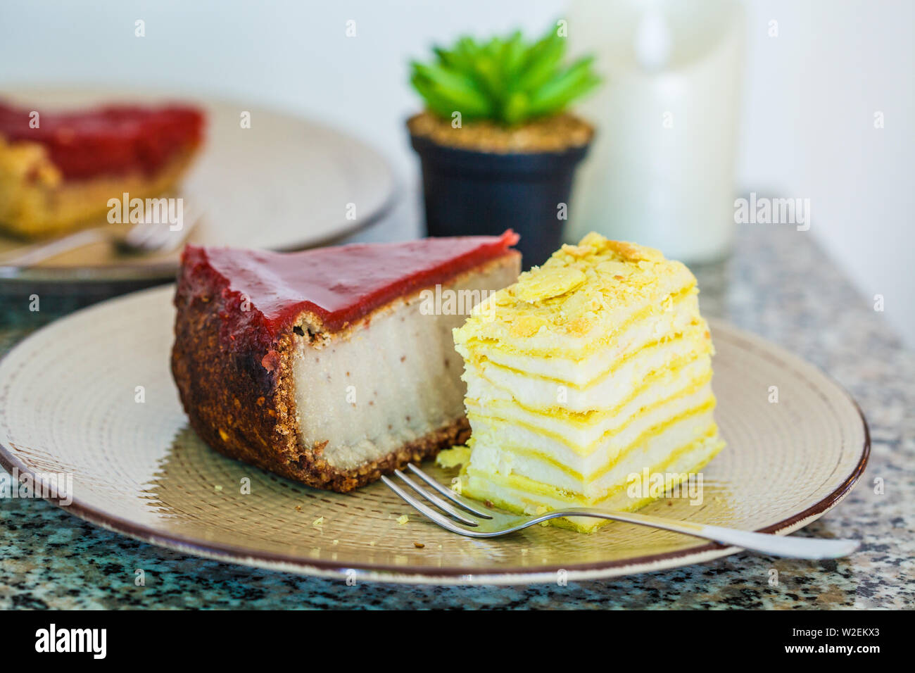 Vegan desserts: berry cake, napoleon cake and cheesecake in a ...