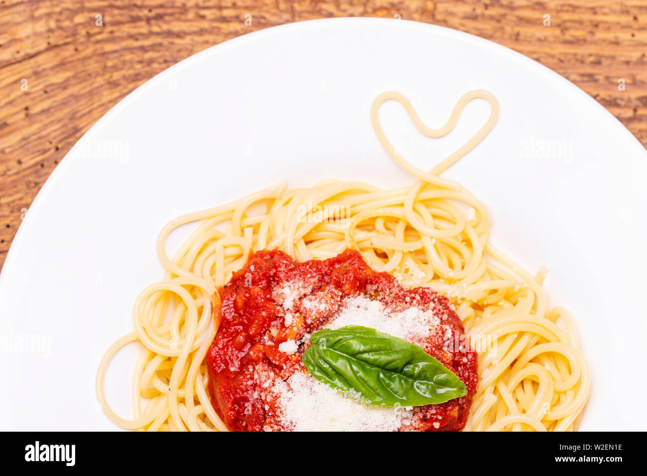 spaghetti heart on dark wood Stock Photo - Alamy