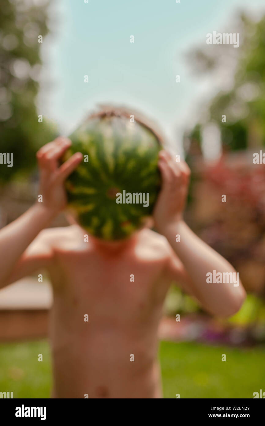 a face full of watermelon, in a summer haze Stock Photo - Alamy