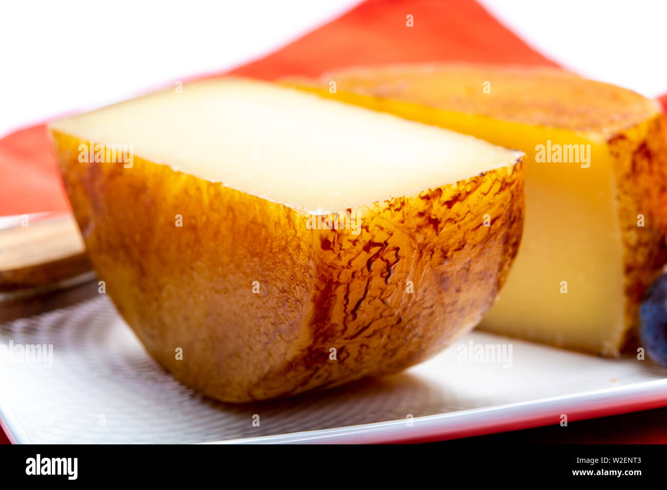 Hard Italian pecorino sheep cheese in two pieces close up isolated ...