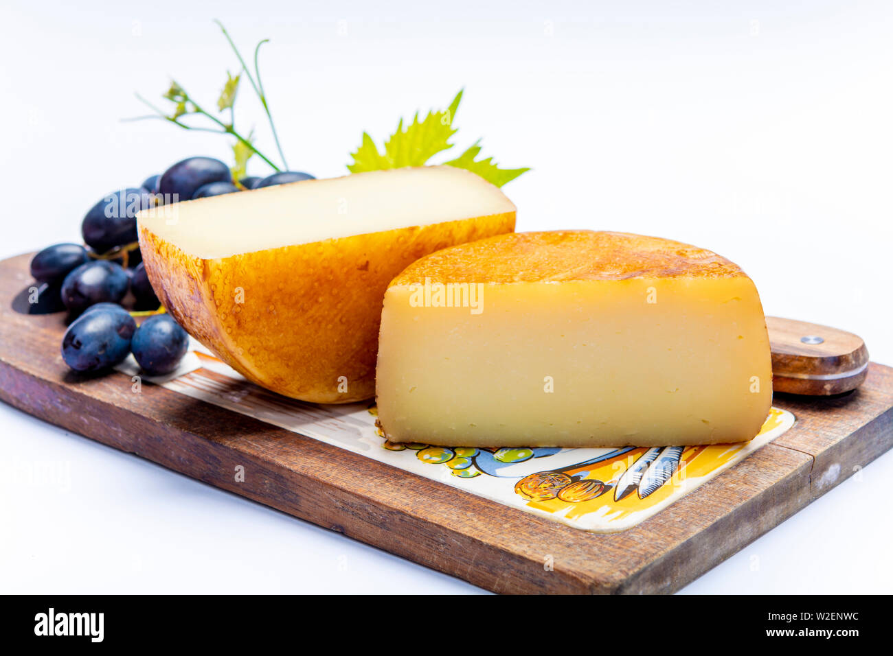 Hard Italian pecorino sheep cheese in two pieces close up isolated ...