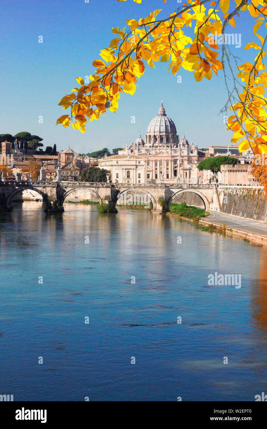 St. Peter's cathedral over bridge and river water in Rome, Italy at ...