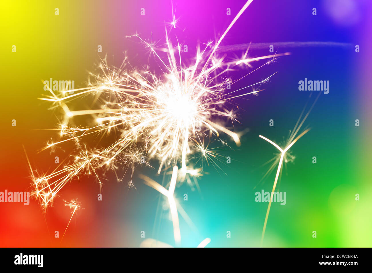 Sparks from hand cold fireworks colorful background Stock Photo - Alamy