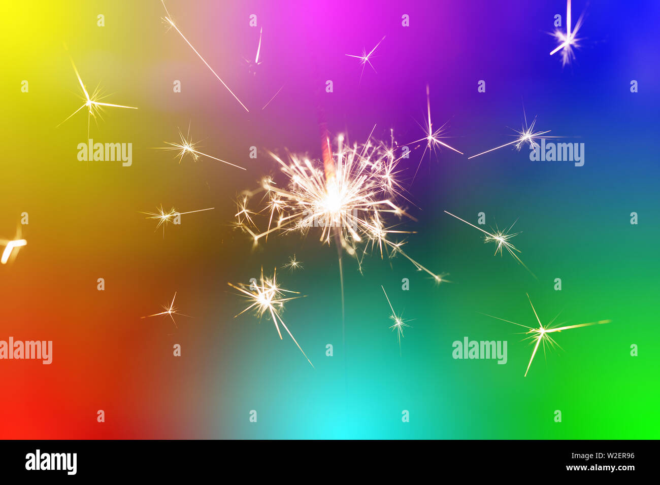 Sparks from hand cold fireworks colorful background Stock Photo - Alamy