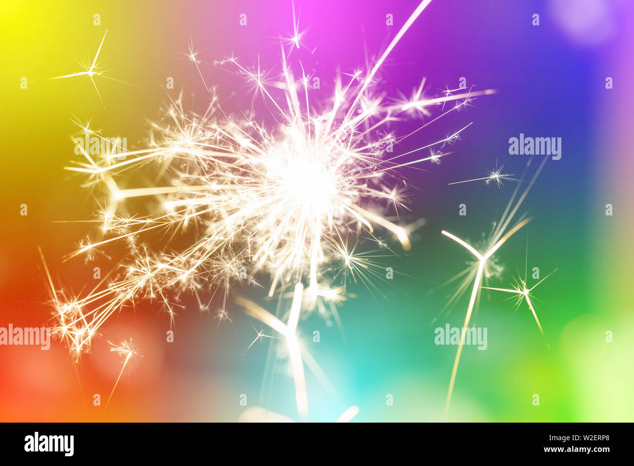 Sparks from hand cold fireworks colorful background Stock Photo - Alamy