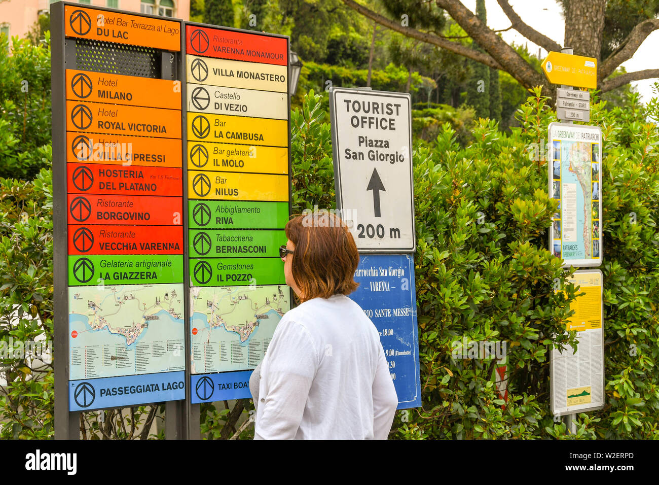 VARENNA, LAKE COMO, ITALY - JUNE 2019: Person looking at a map of ...