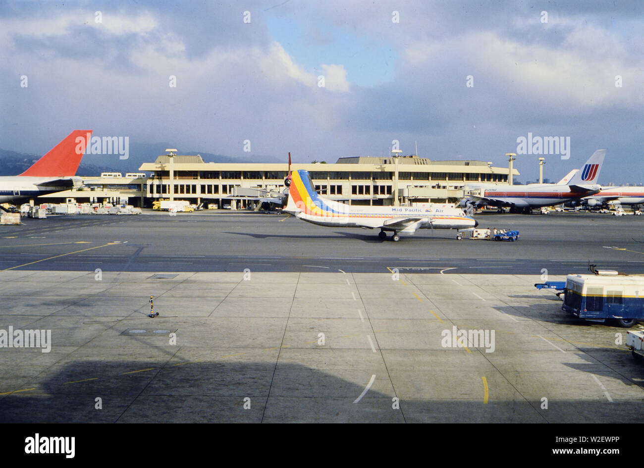 Mid Pacific Air jet airplane and United Airlines plane at one of Hawaii ...