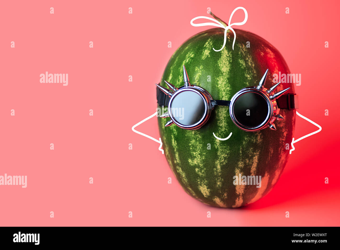 watermelon punk in rocker glasses on pink background Stock Photo - Alamy