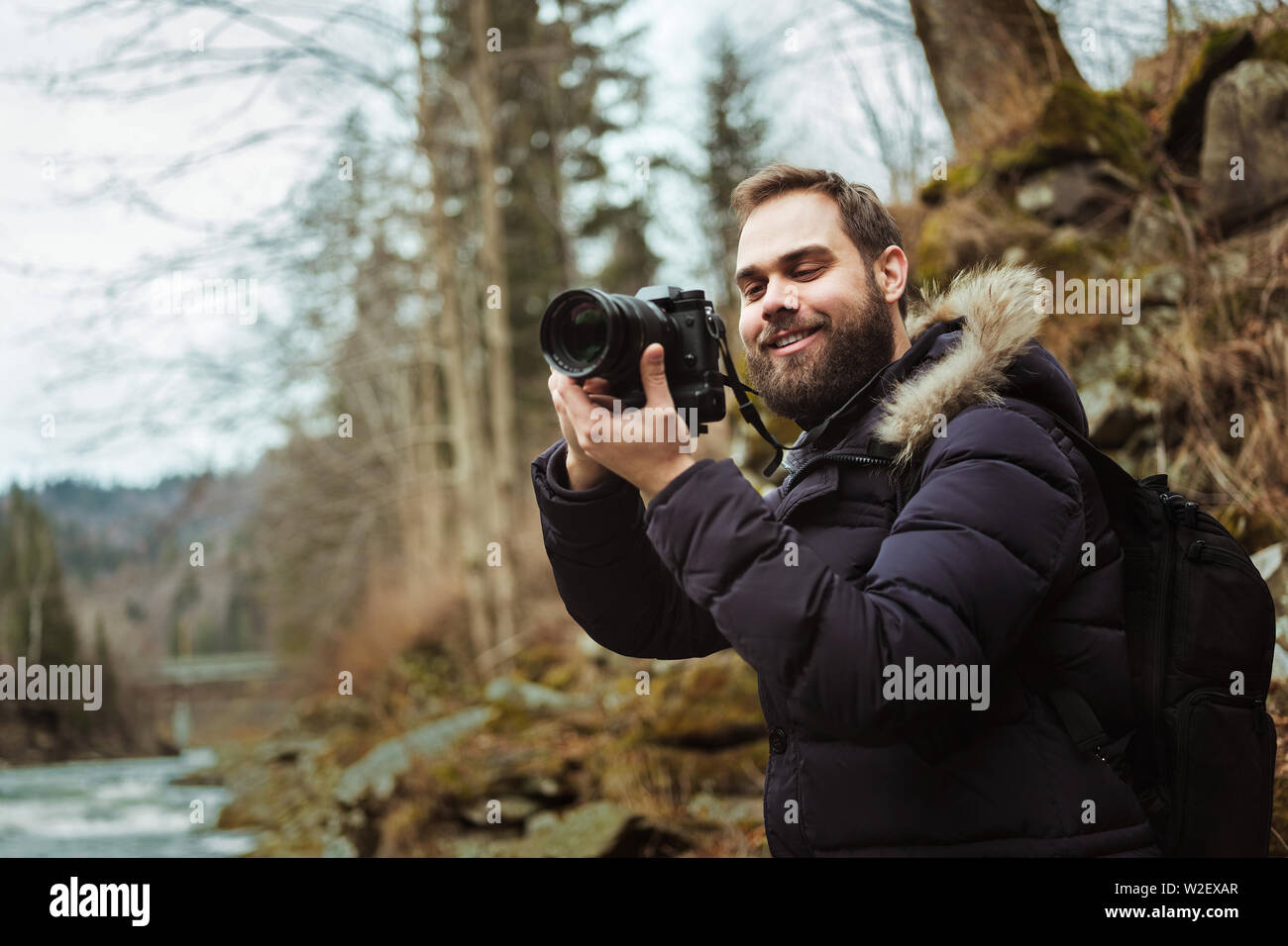 Man traveler photographer with camera photographing the wildlife Stock ...