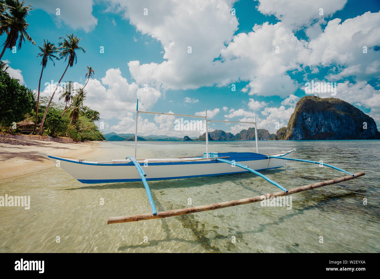 Seaview with traditional fishing boat on the beach under cloudy sky in ...