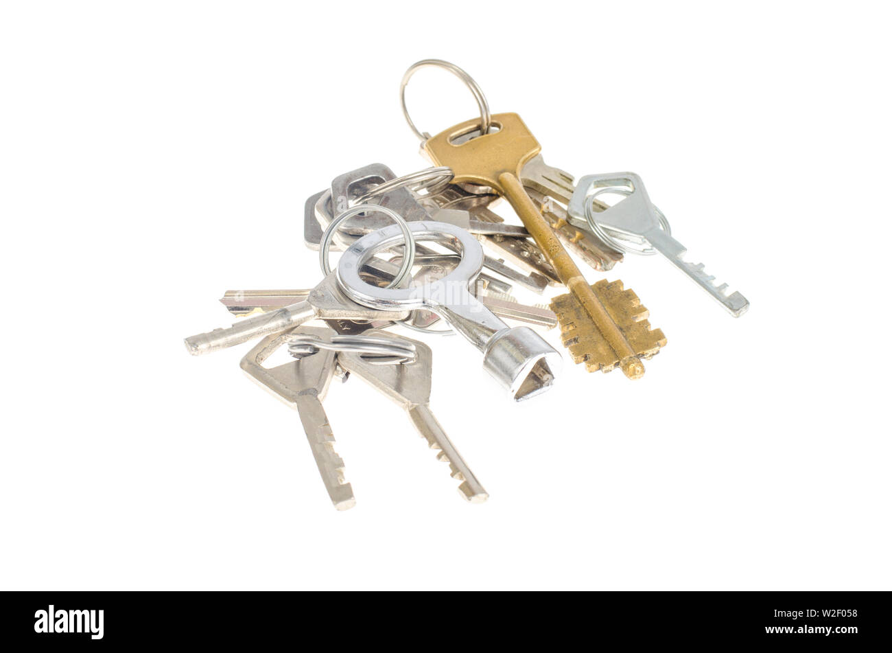 Bundles of old keys on white background Stock Photo - Alamy