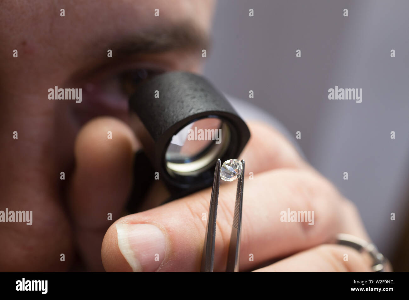 Inspecting a Diamond Stock Photo - Alamy