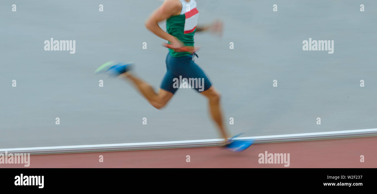 Motion blurred view of a man running Stock Photo - Alamy