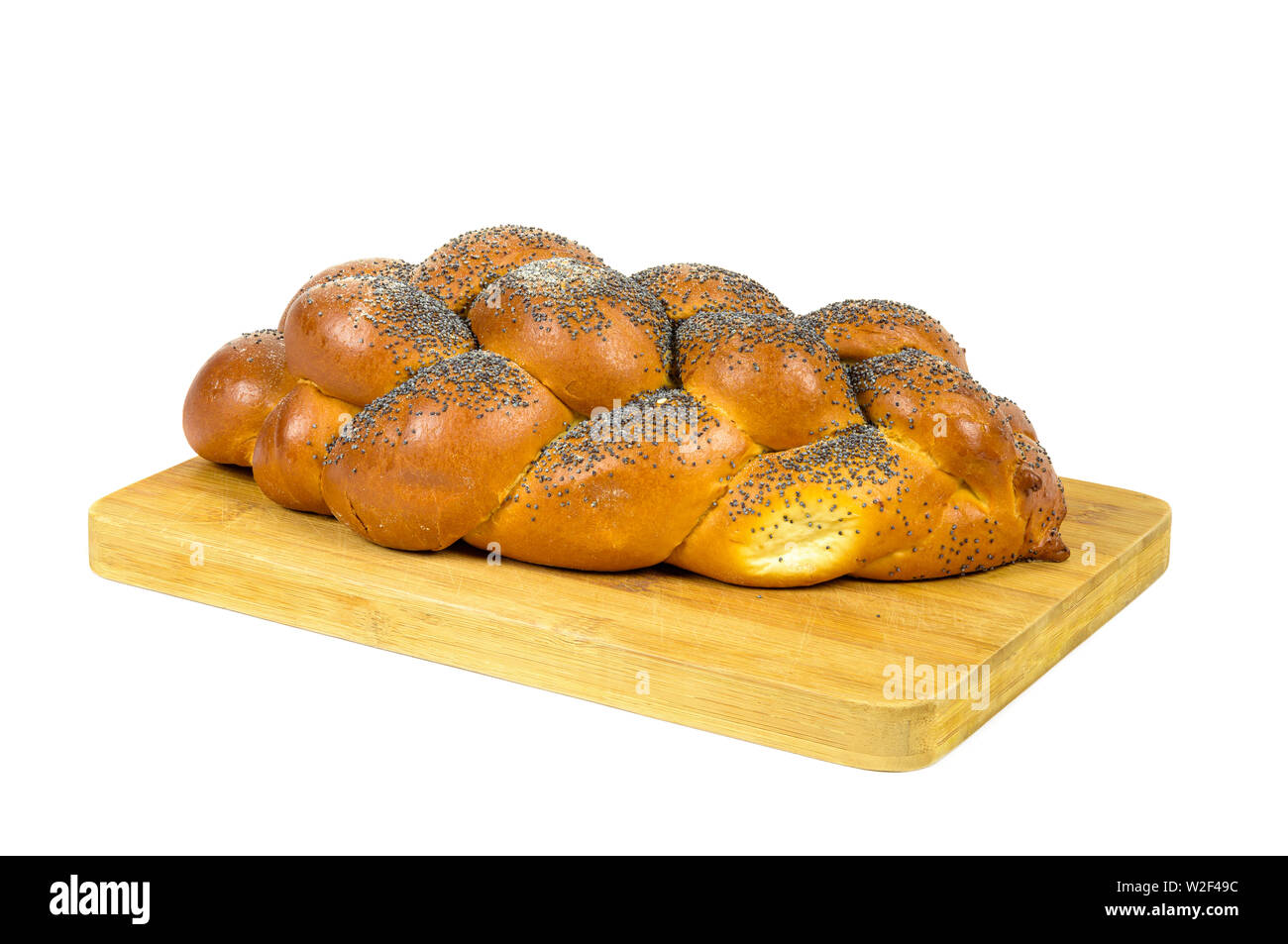 Fresh whole challah bread on chopping board isolated on white ...