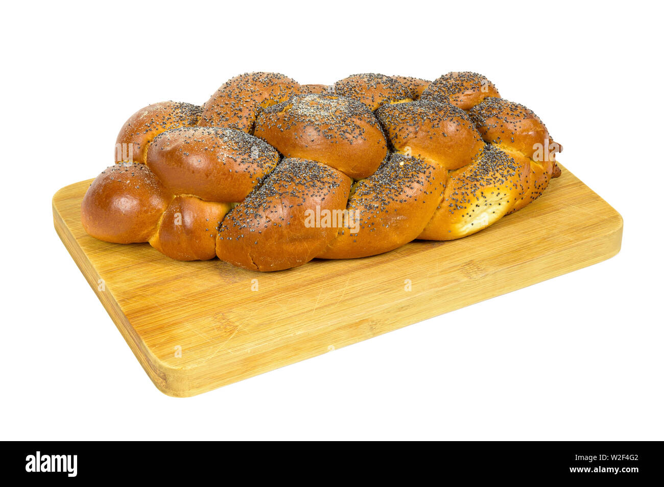 Fresh whole challah bread on chopping board isolated on white ...