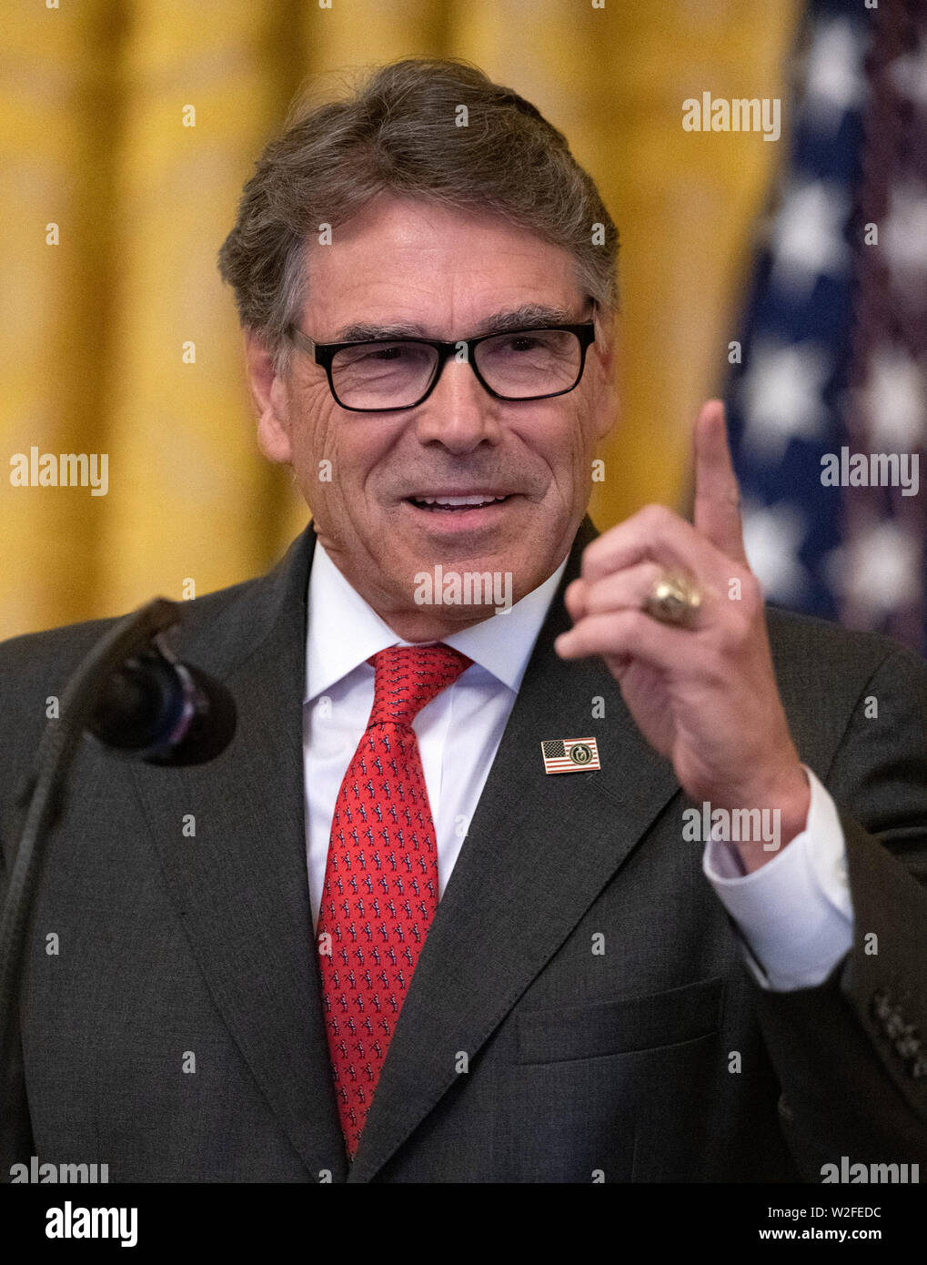 United States Secretary of Energy Rick Perry, left, makes remarks on ...
