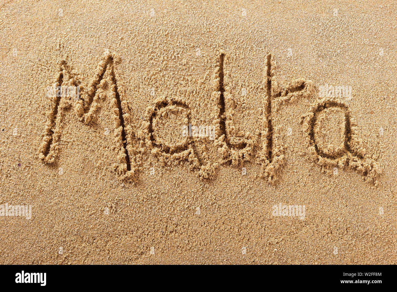 Malta hand written beach word travel concept Stock Photo - Alamy