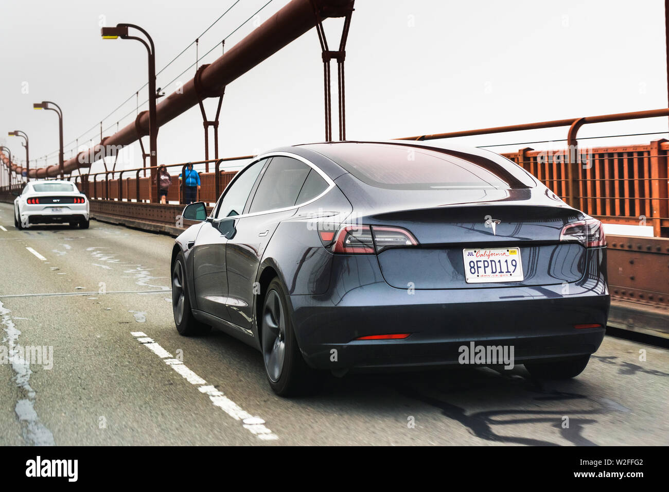 July 4, 2019 San Francisco / CA / USA - Model 3 Tesla driving on the ...