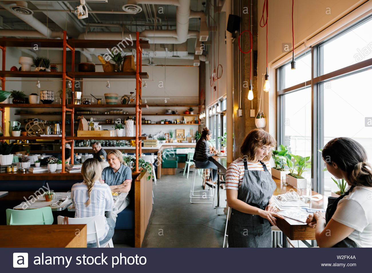 Hostess restaurant table hi-res stock photography and images - Alamy
