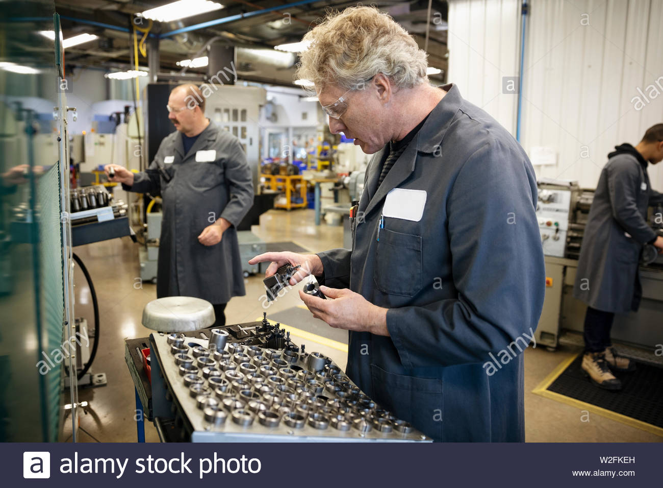 Factory line uniform hi-res stock photography and images - Alamy