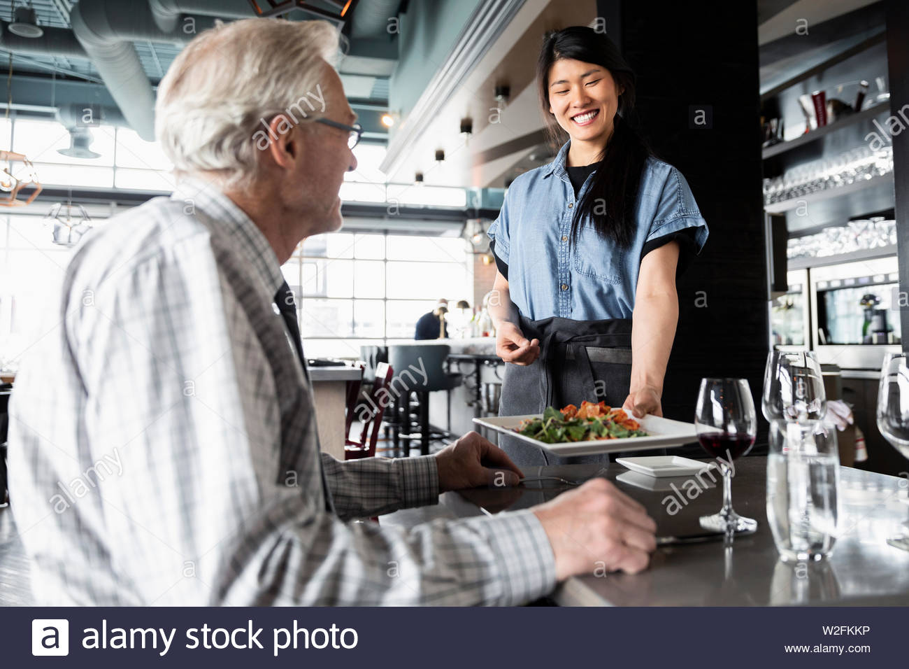 Man serving drinks hi-res stock photography and images - Alamy
