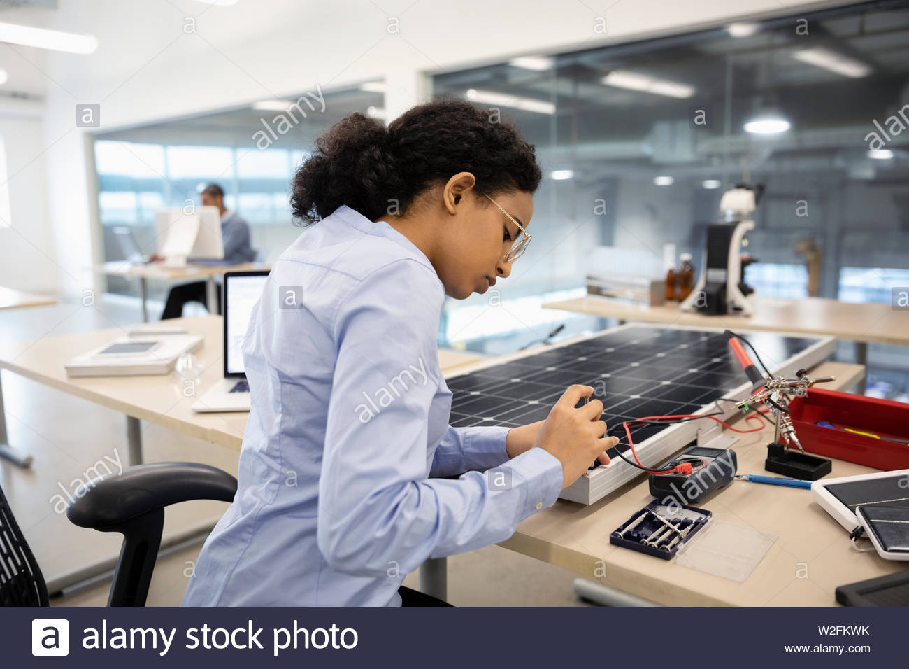 Women solar power hi-res stock photography and images - Alamy