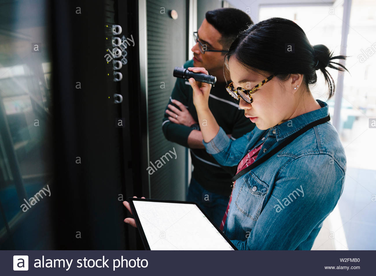 Technicians talking in server room hi-res stock photography and images ...