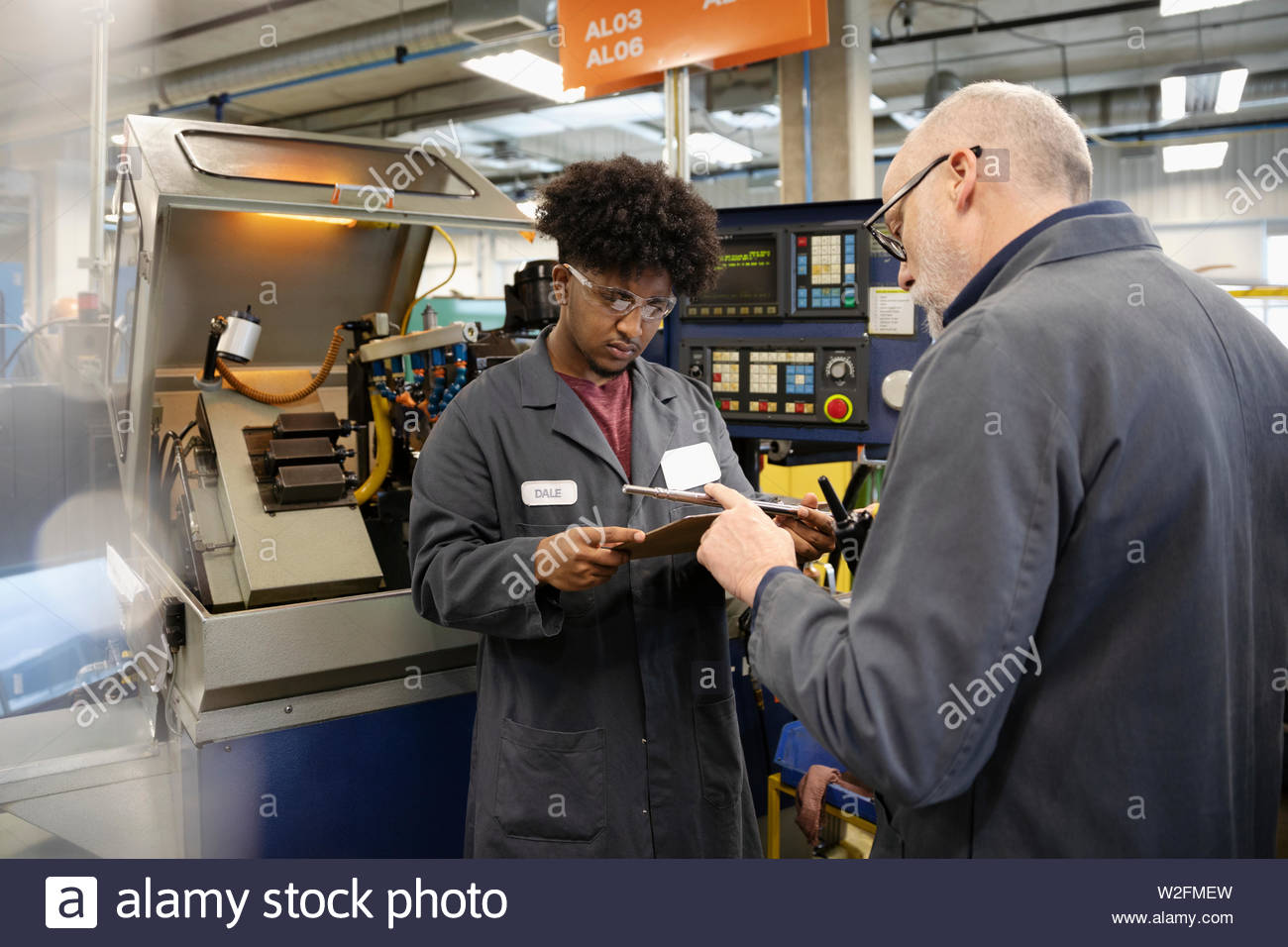 Industry examining watching holding expertise hi-res stock photography ...