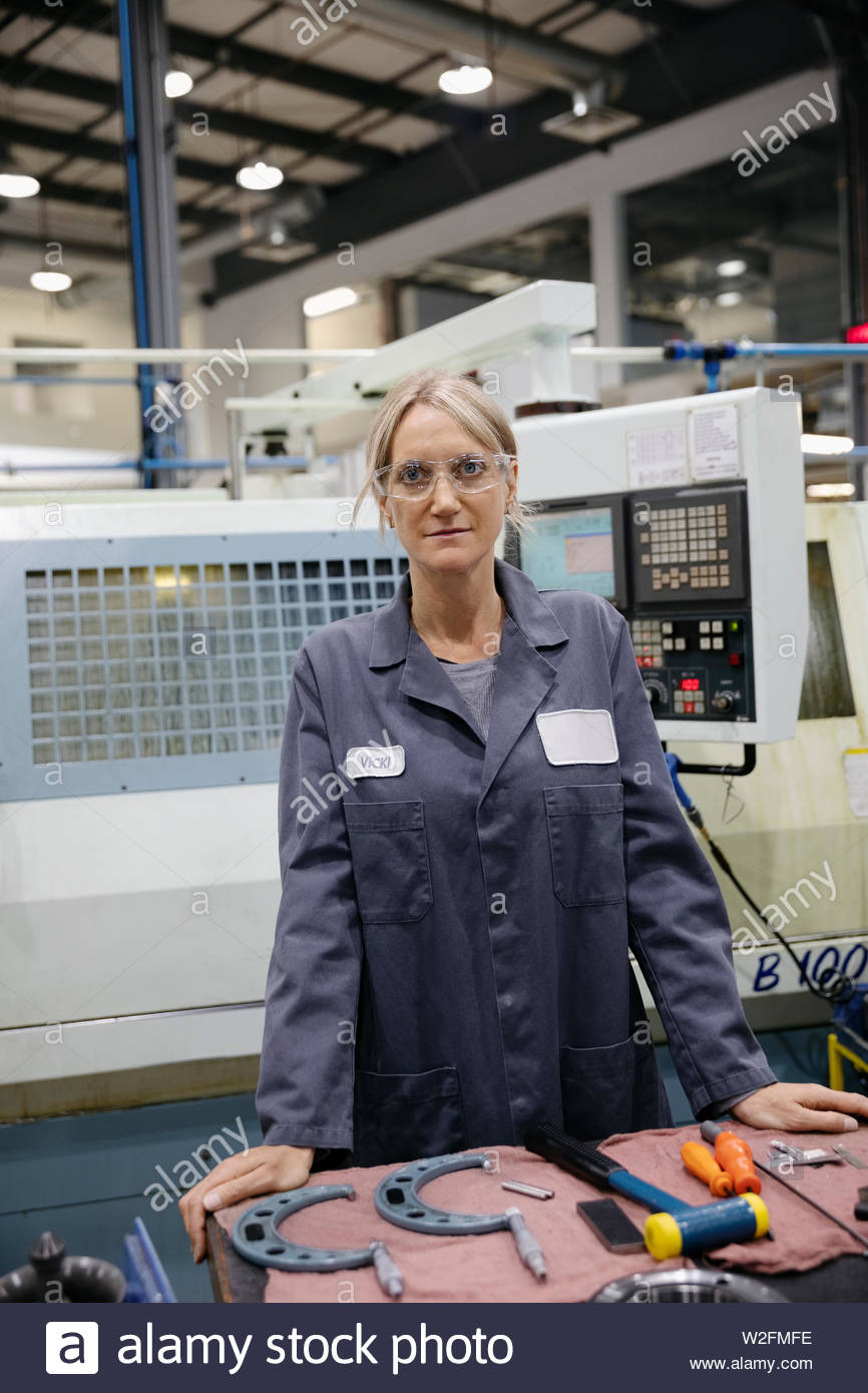 Portrait confident female machinist working in factory Stock Photo - Alamy