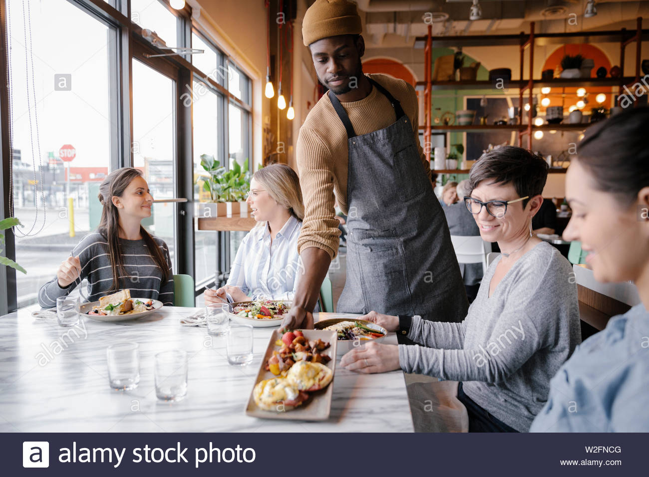 American women serving hi-res stock photography and images - Alamy