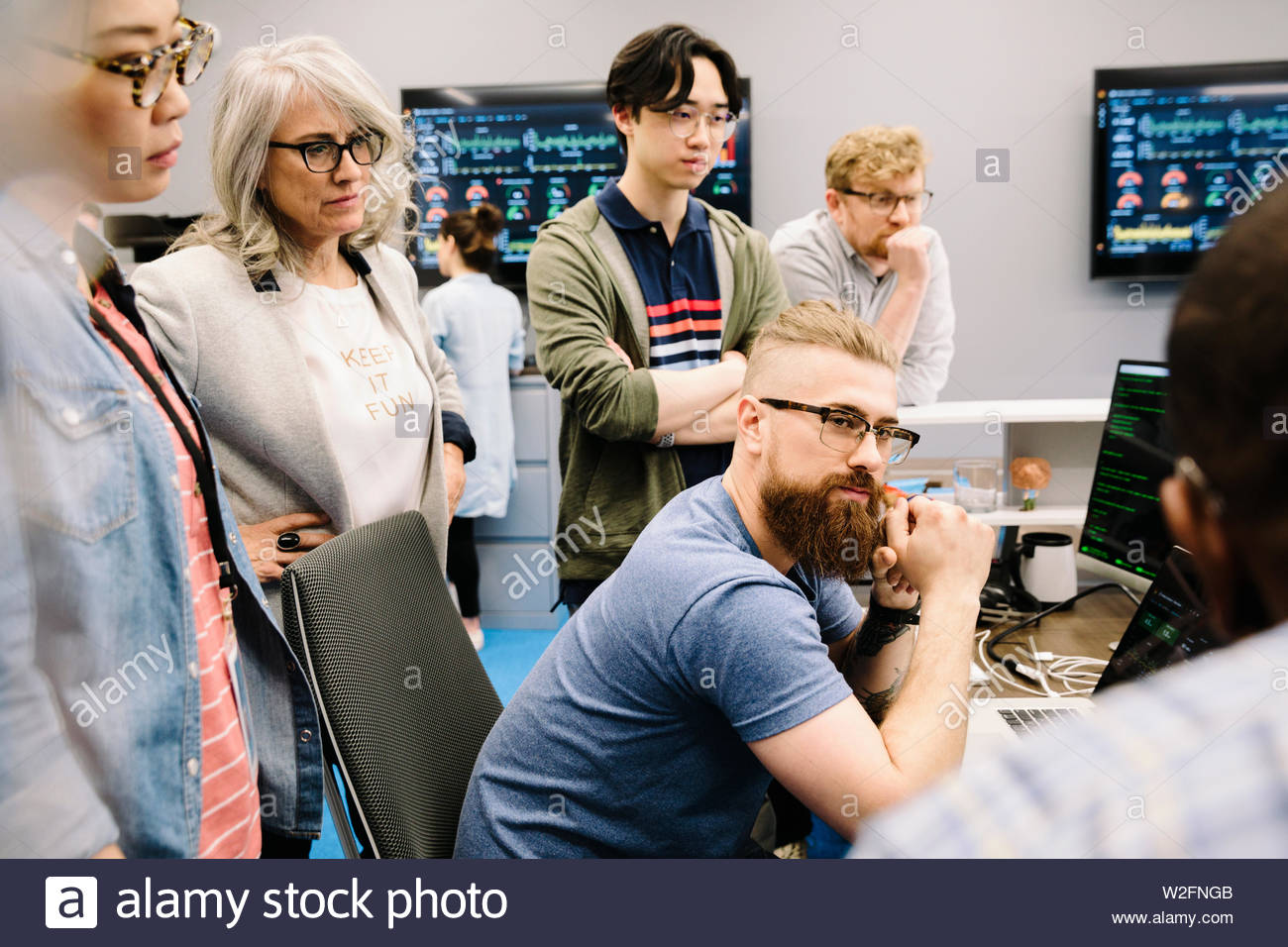 Computer programmers discussing hi-res stock photography and images - Alamy