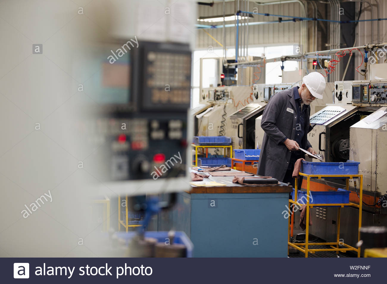 Men inspecting hi-res stock photography and images - Alamy
