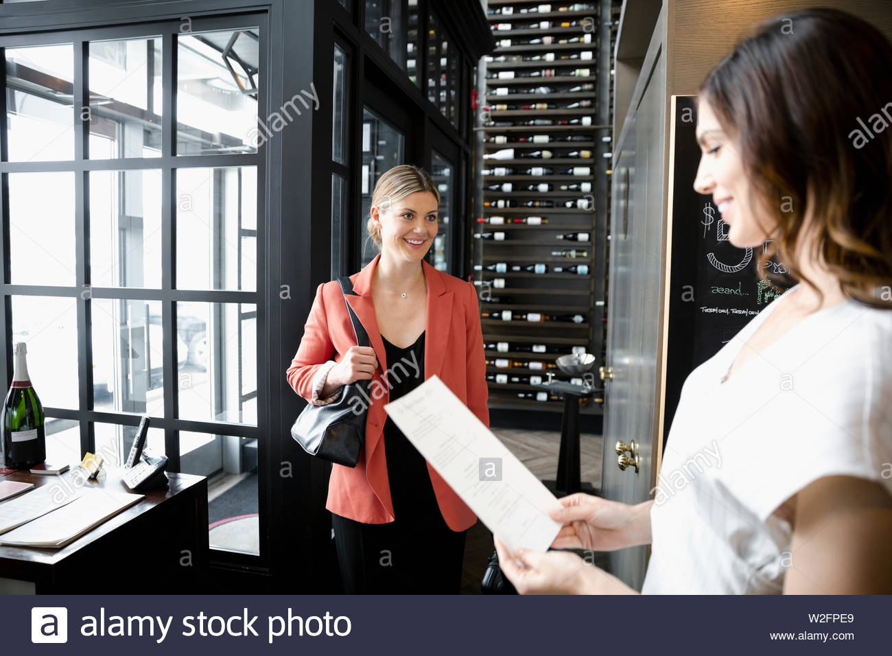 Two people looking at a menu hi-res stock photography and images - Alamy