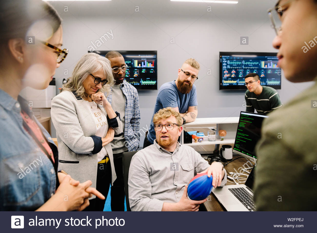 Computer programmers discussing hi-res stock photography and images - Alamy