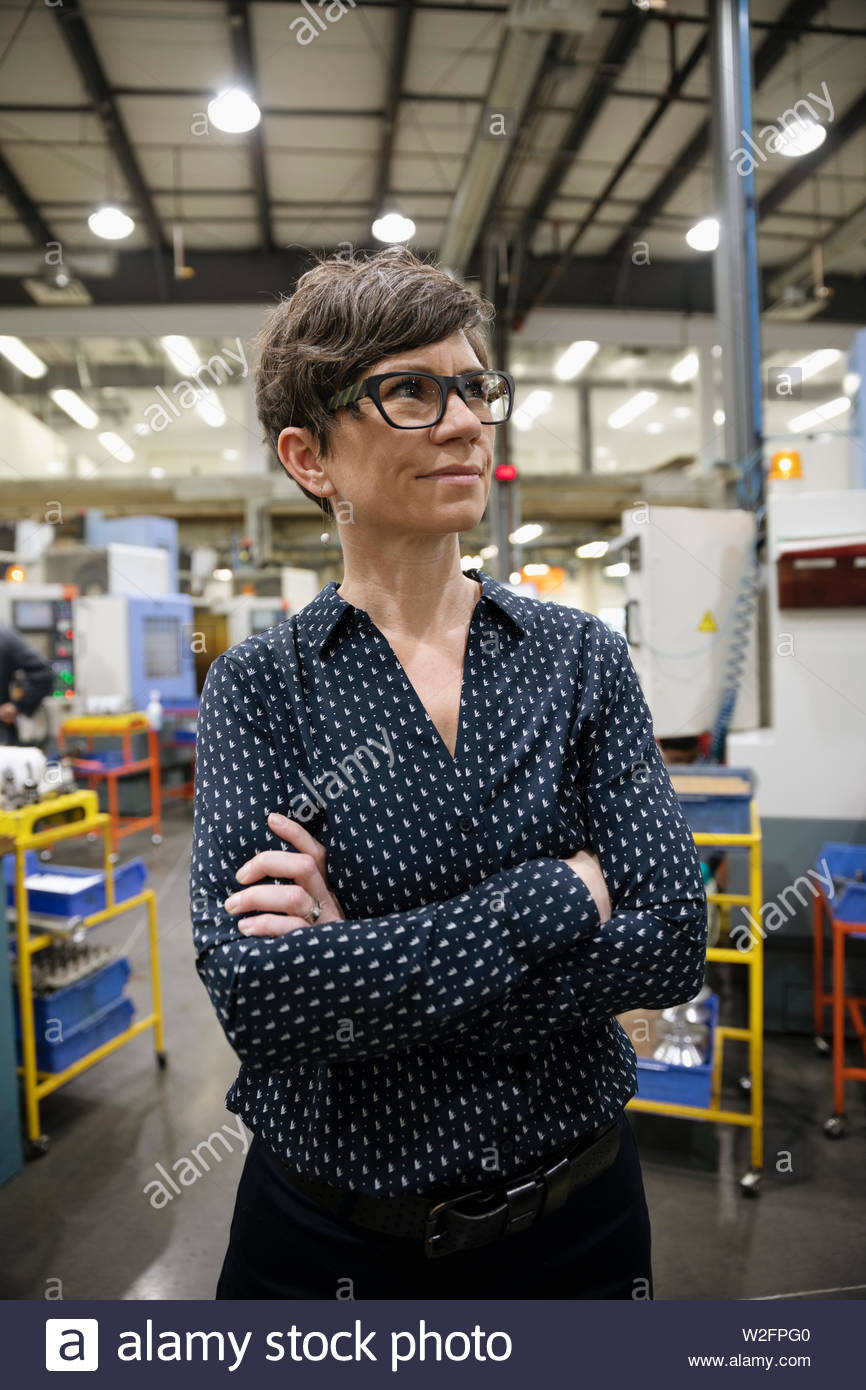 Portrait female factory standing arms hi-res stock photography and ...